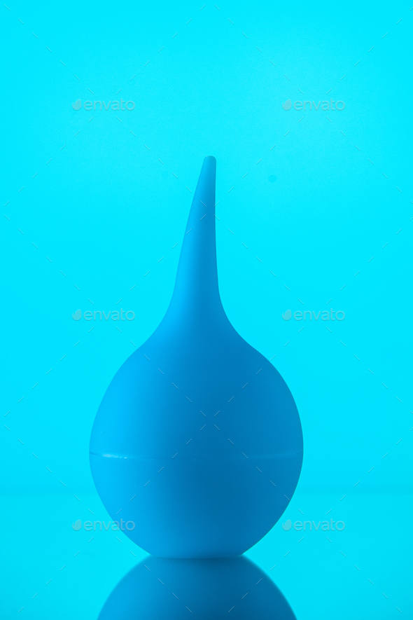front view squeeze bulb on light blue background Stock Photo by ImgSolut