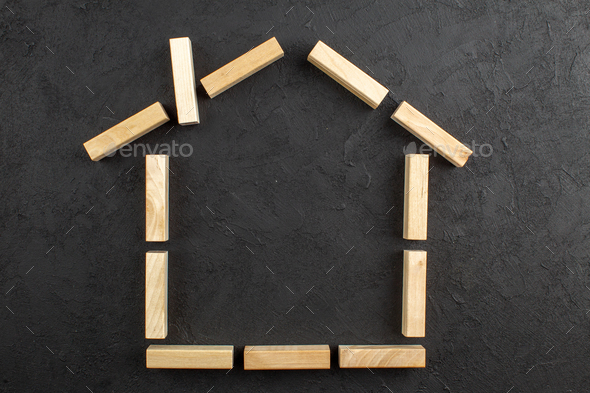 top view house shaped wood blocks on black background Stock Photo by ...