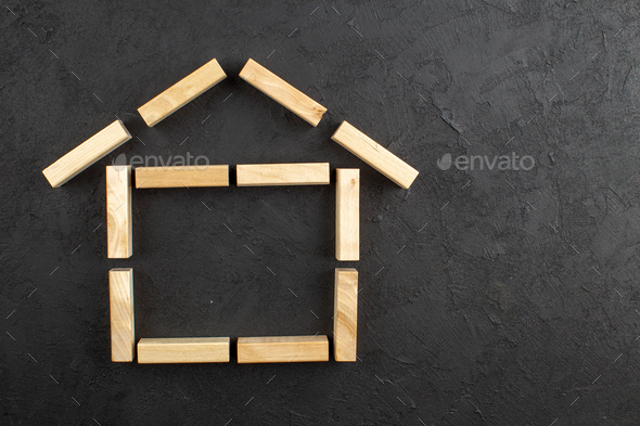 top view house shaped wood blocks on black background copy space Stock ...