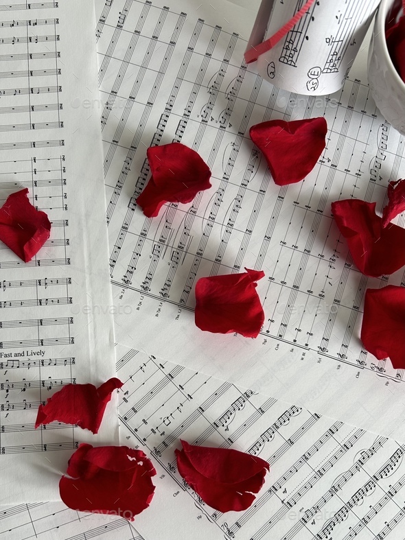 Music sheets with red rose petals Stock Photo by melpaul199 | PhotoDune