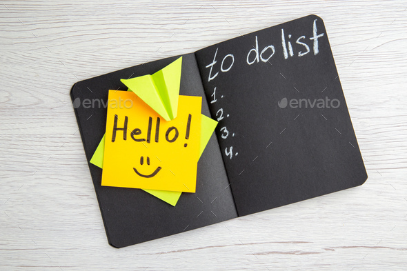 top view open dark notepad with hello note on white background business ...