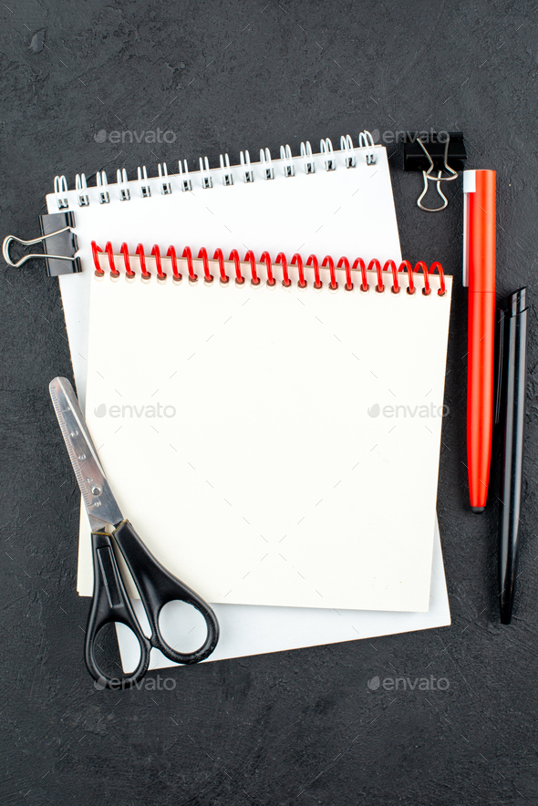 top view spiral notebooks scissors pens binder clips on table Stock ...