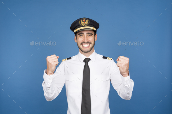Young pilot celebrating with an excited expression. Stock Photo by ...