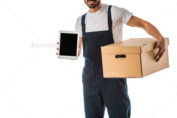 partial view of delivery man with carton box holding digital tablet ...