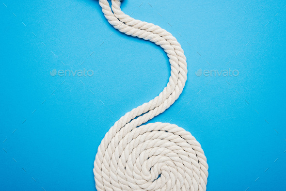 long white waved and twisted ropes isolated on blue Stock Photo by ...