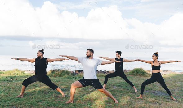 Group of multicultural athletes recreating doing yoga poses feeling ...