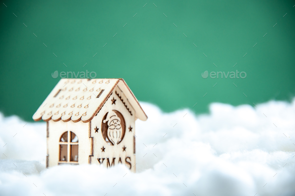 front view mini wood house on green background free place Stock Photo ...
