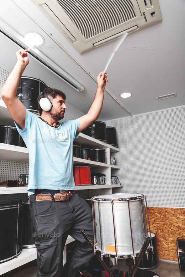 percussion musician with a drum in front of him in a leading pose Stock ...