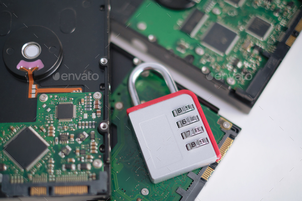 Encrypted hard disk. Padlock with cipher on an opened hard disk. Stock ...