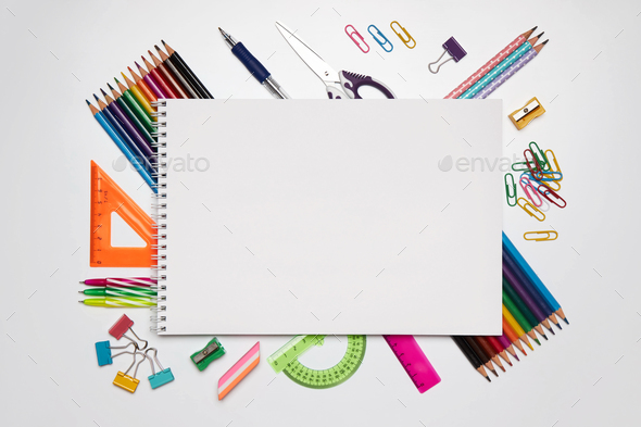 Colored school supplies for learning on a white background. Back to ...