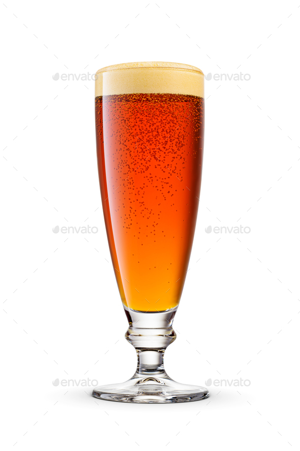Flute glass of fresh dark brown beer with cap of foam isolated on white ...