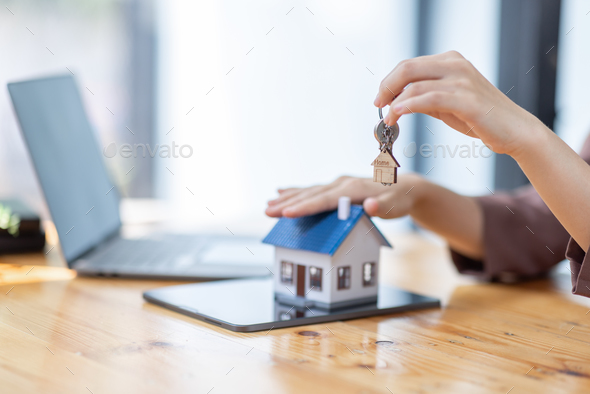 hands holding modern house key, family home, homeless shelter and real ...