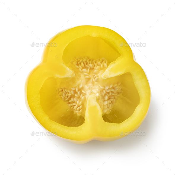 Seeds in a fresh yellow bell pepper inside close up on white background ...