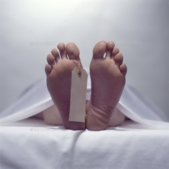 Feet of a dead corpse with a label in the morgue Stock Photo by ...