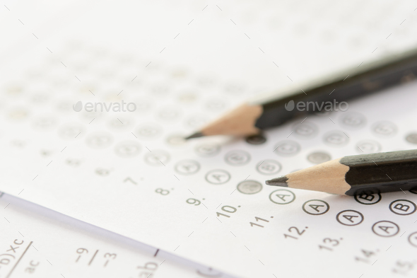 Pencil on answer sheets or Standardized test form with answers bubbled ...