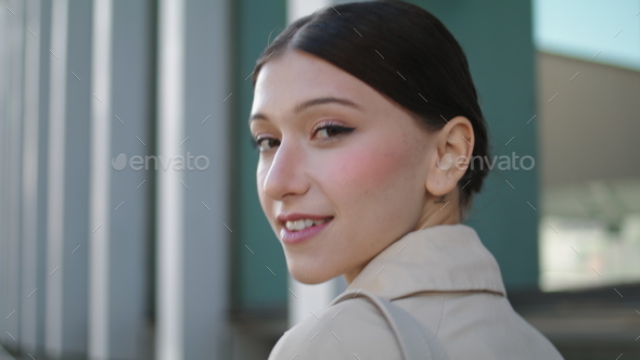 Portrait cheerful walking girl turning face to camera with carefree ...