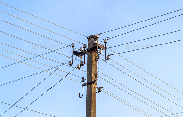 Electric pole power lines and wires with blue sky Stock Photo by bilanol