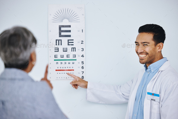 Eye exam, doctor and patient with vision and healthcare, reading chart ...