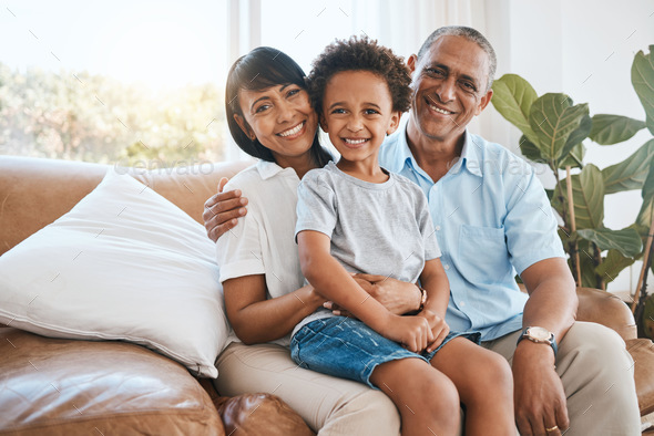 Portrait, grandparents and kid smile in home living room on sofa ...