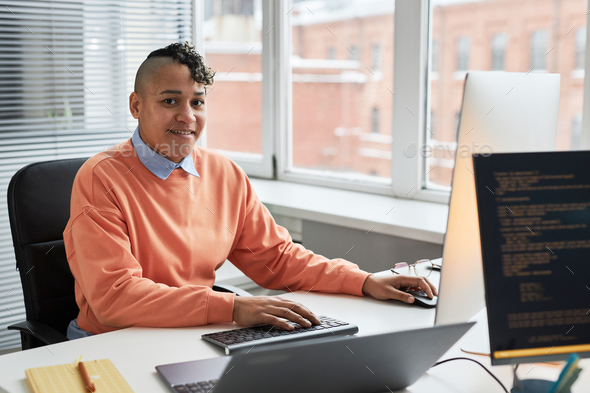 Programmer working with security codes on computer Stock Photo by seventyfourimages