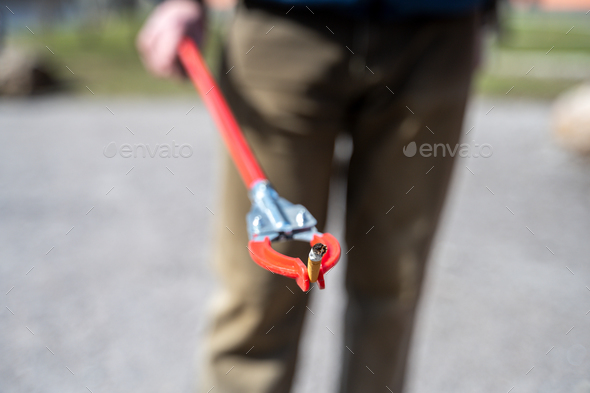 Person with Grabber Reacher Tool Stock Photo by molenira | PhotoDune