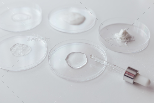 Cosmetics Samples in Laboratory Glassware on white background ...