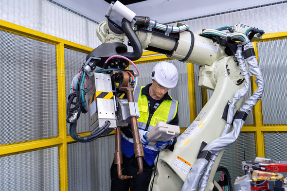 Engineer service robot welding in factory software programming ...