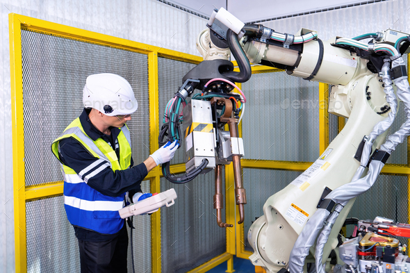 Engineer service robot welding in factory software programming ...