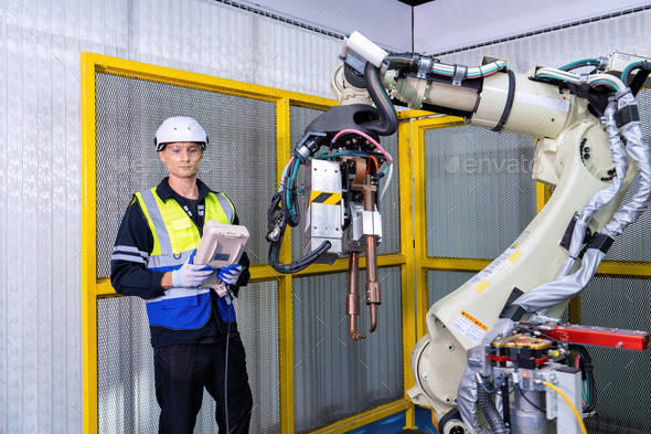 Engineer service robot welding in factory software programming ...