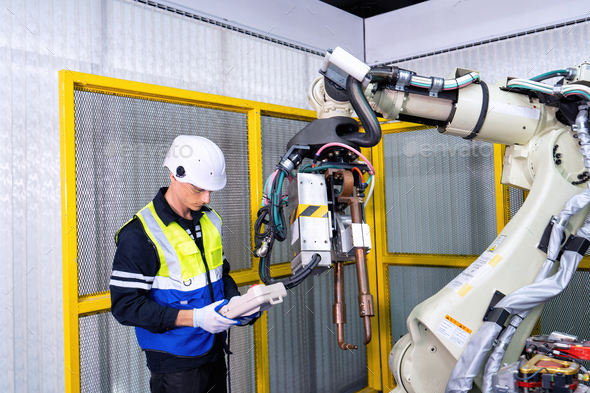 Engineer service robot welding in factory software programming ...