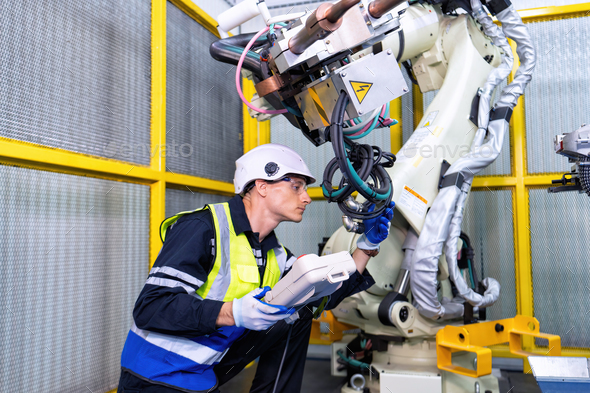 Engineer service robot welding in factory software programming ...