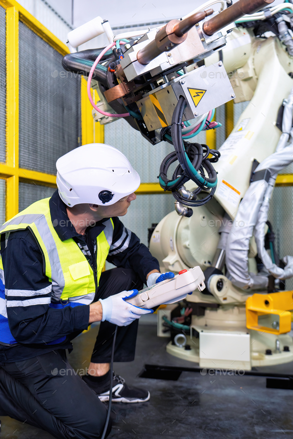 Engineer service robot welding in factory software programming ...