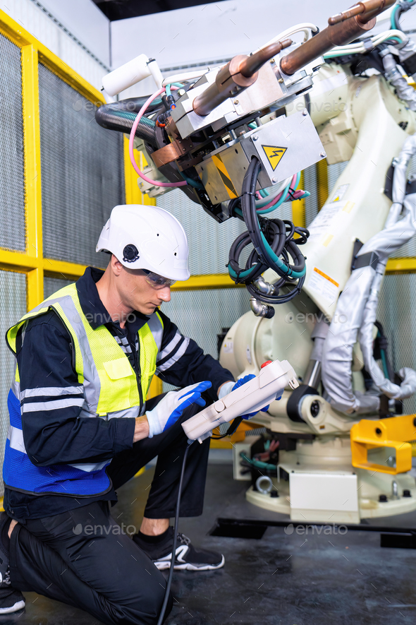 Engineer service robot welding in factory software programming ...
