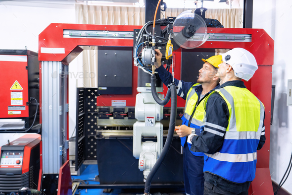Engineer service robot welding in factory software programming ...