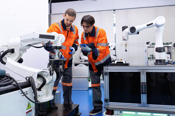 Engineer service robot welding in factory software programming ...