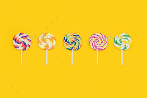 Fruit Rainbow Swirl Flat Lollipops in a row. Lollipop candy set. Stock ...