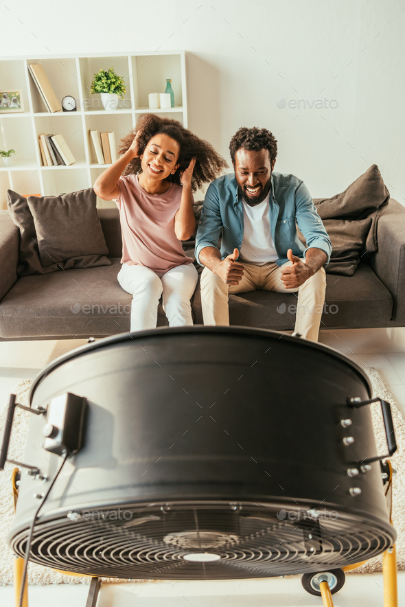 Happy African American Man Showing Thumbs Up While Sitting Near