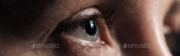 close up view of human eye looking away in dark, panoramic shot Stock ...