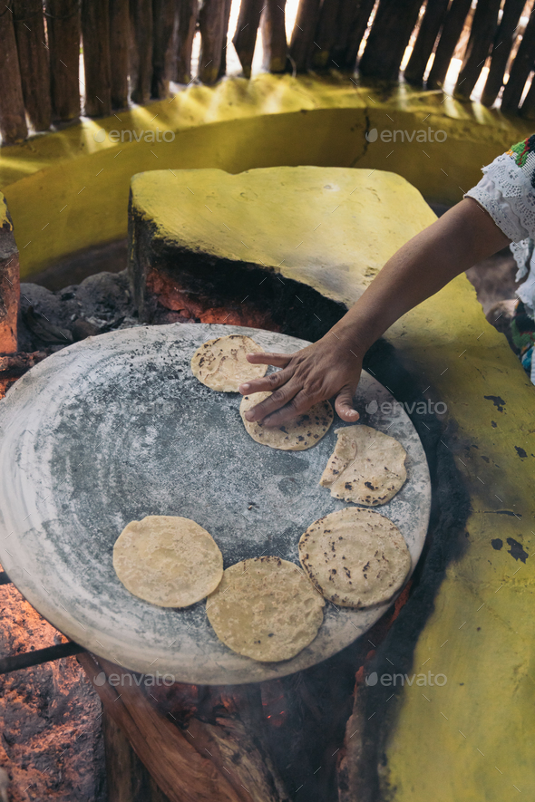 View of female indigenous hand making tortillas Stock Photo by AmparoGV