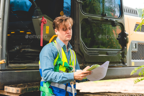 Construction worker person with backhoe loader or industry tractor ...