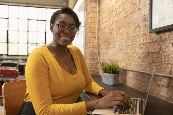 portrait happy smile african black woman office employee sitting in ...