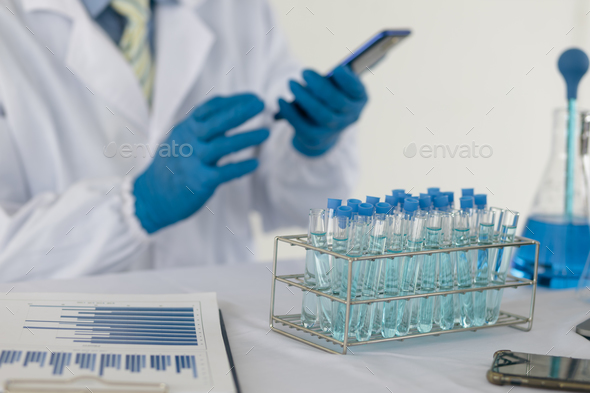 Scientists work with in vitro reagents in laboratories and draw ...