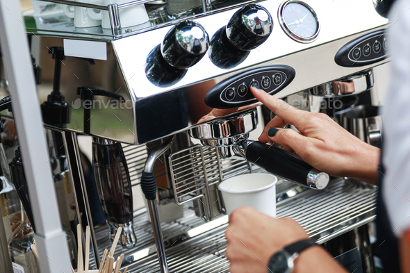 Barista making coffee using professional espresso machine Stock Photo ...