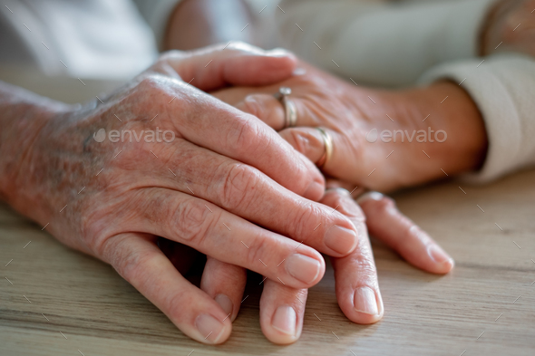 Old people holding hands close up view, senior retired family couple ...