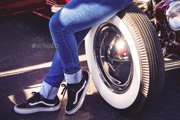 Female's feet sitting on a vintage car's wheel - modern vs vintage ...