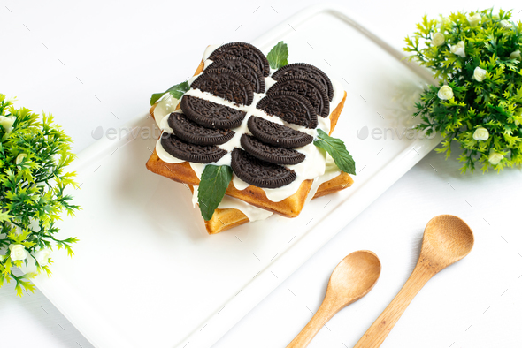 a front view cookie cake with custard and choco cookies delicious ...