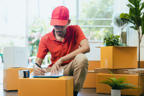 Delivery man checking delivery list before sent to customer Stock Photo ...