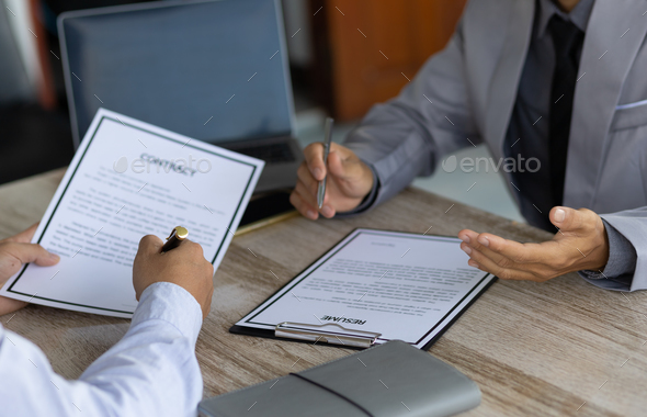 Job interview and signing of employment contract documents. Stock Photo ...