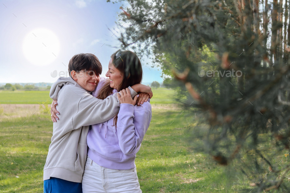Mother and son spending time together. Parents and teen. Teenage boy hugs mom. Stock Photo by ...