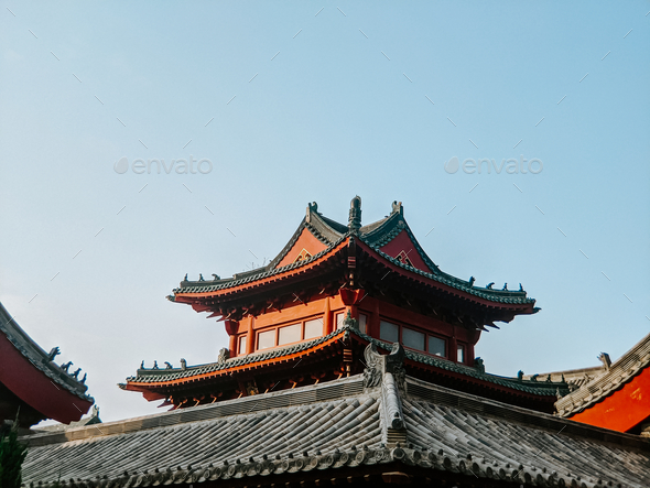 Low angle shot of typical Chinese buildings in the Millennium City Park ...
